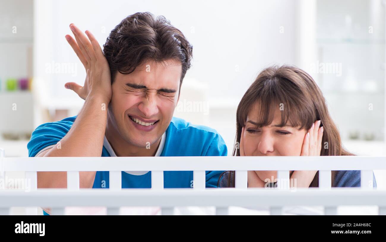 Crying mother baby cot hi-res stock photography and images - Alamy