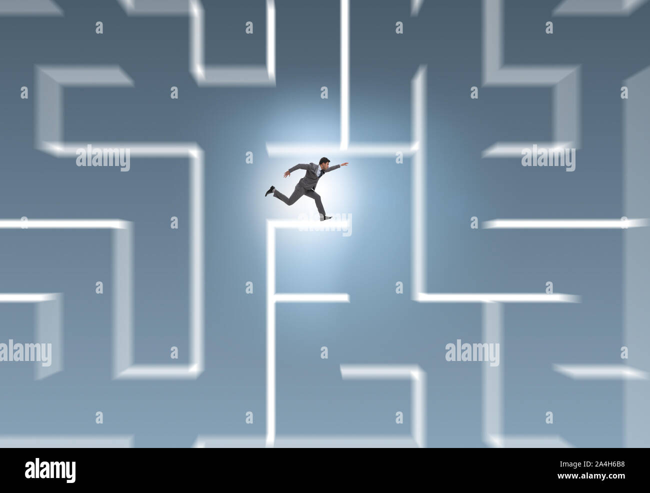 The businessman trying to escape from maze labyrinth Stock Photo - Alamy