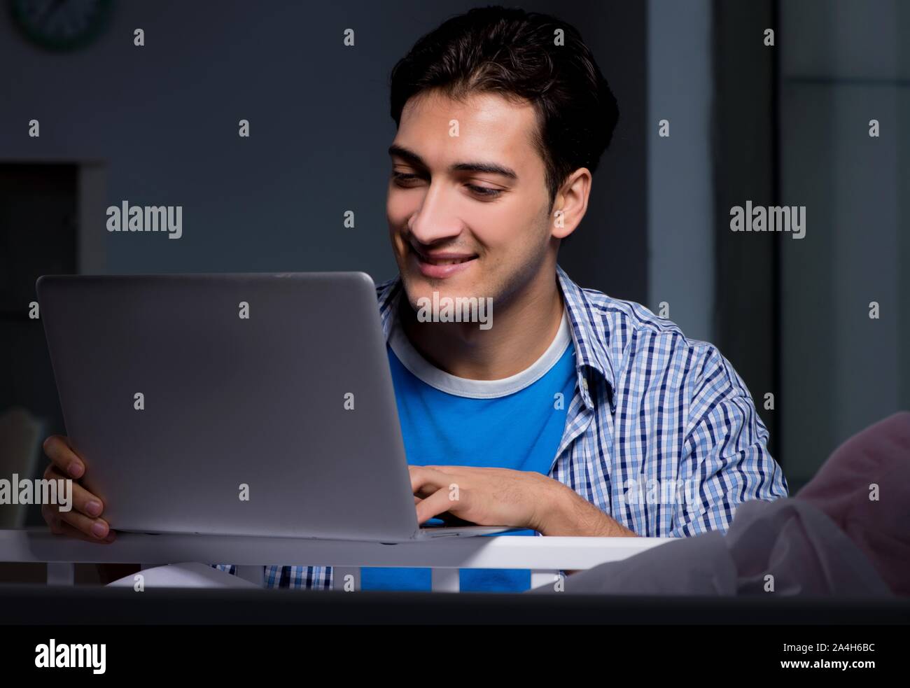 The young student doing homework and looking after newborn baby Stock ...