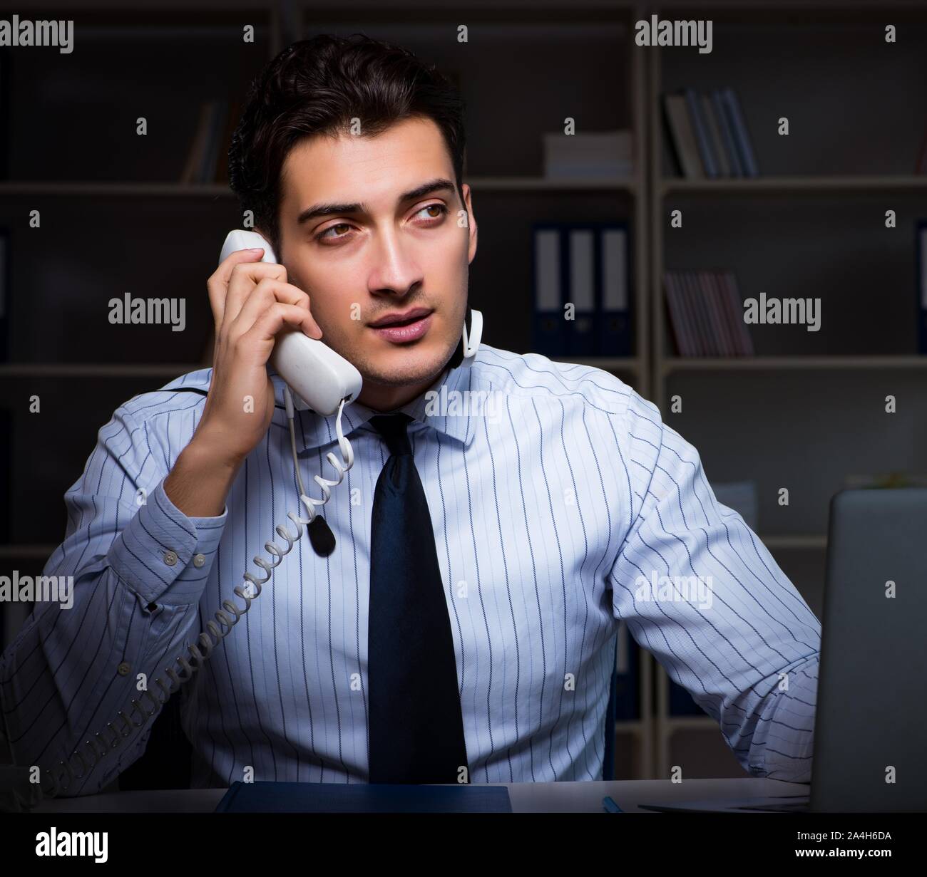 The call center operator talking to customer during night shift Stock ...