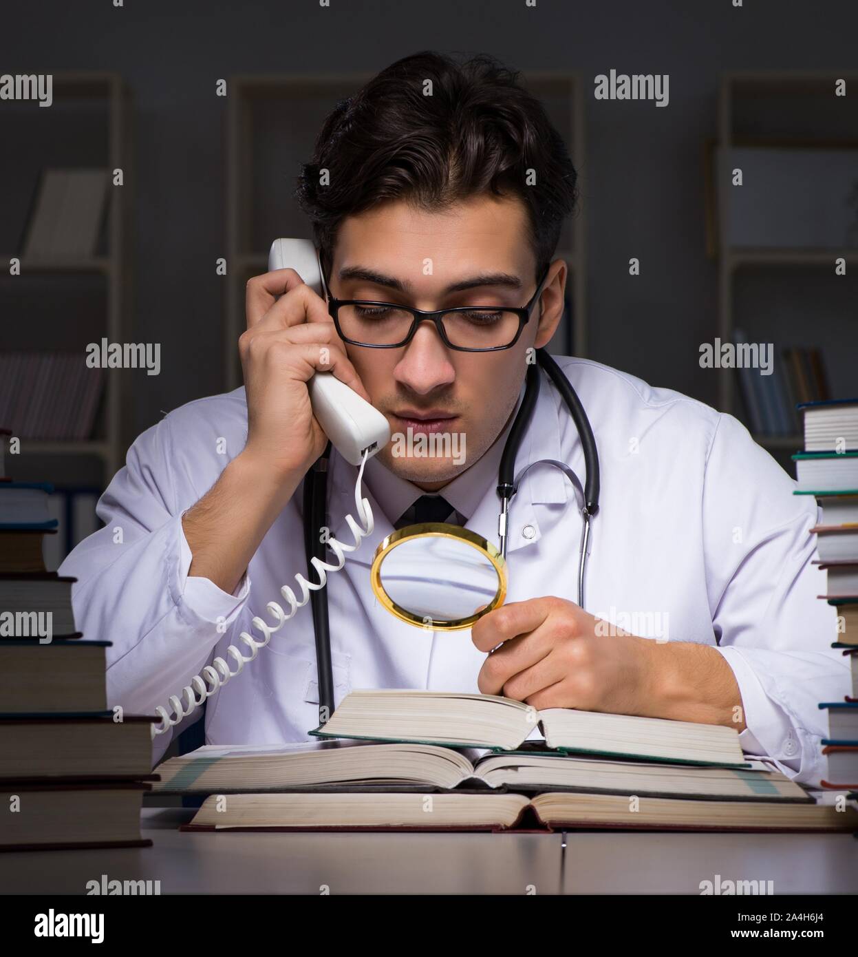 Medical student preparing for university exams at night Stock Photo - Alamy