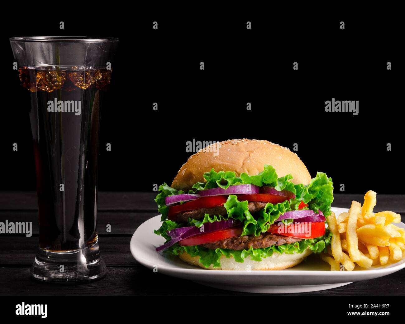 Burger served in bun in nutrition fast food concept Stock Photo - Alamy