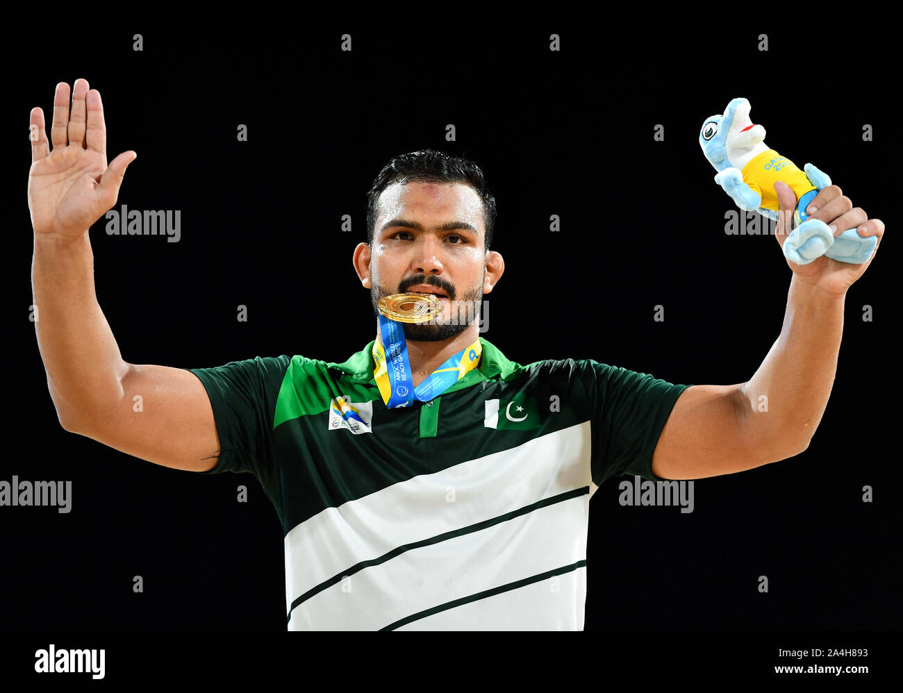 Doha. 14th Oct, 2019. Gold medalist Muhammad Inam of Pakistan poses for ...