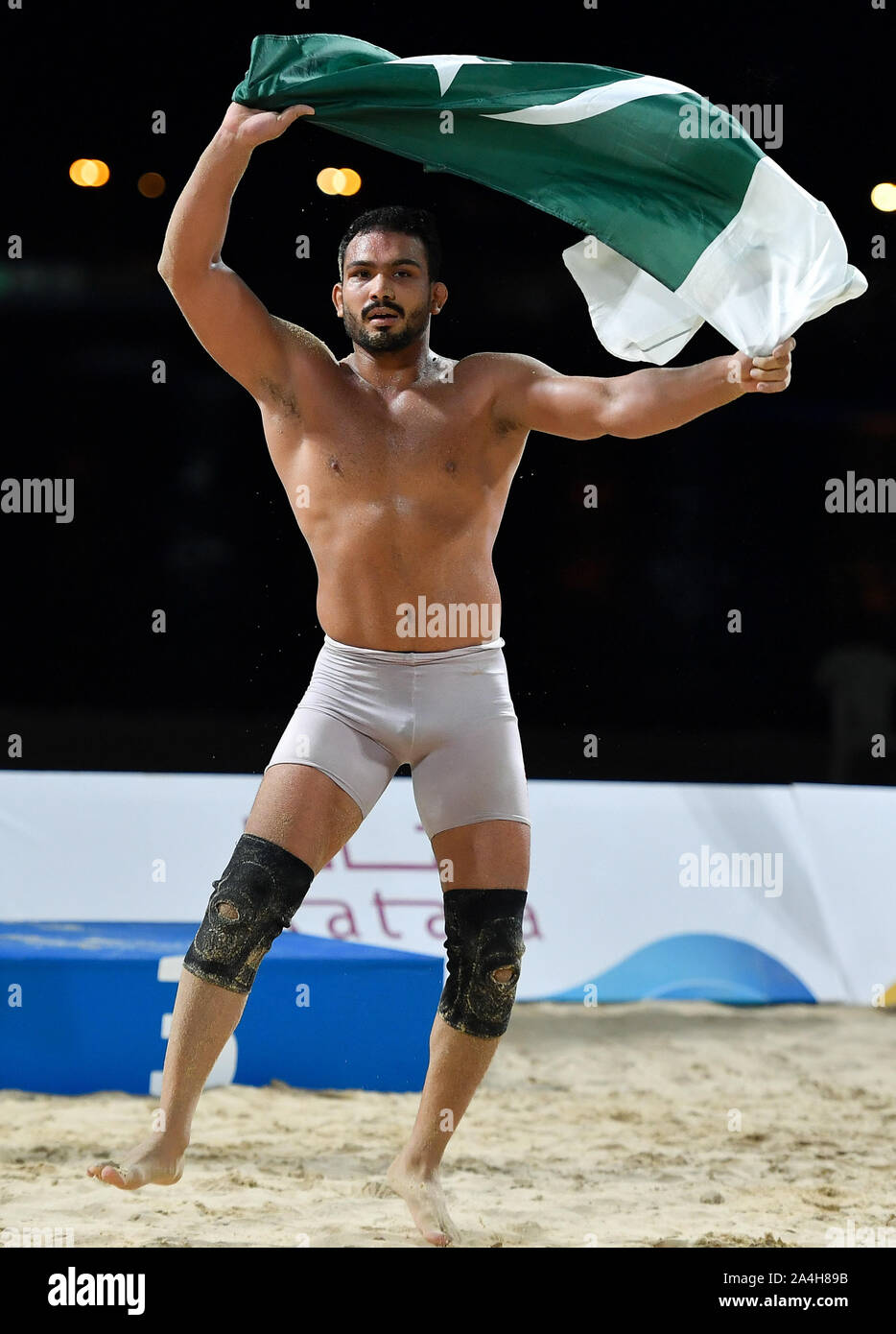 Doha. 14th Oct, 2019. Muhammad Inam (L) of Pakistan celebrates after ...