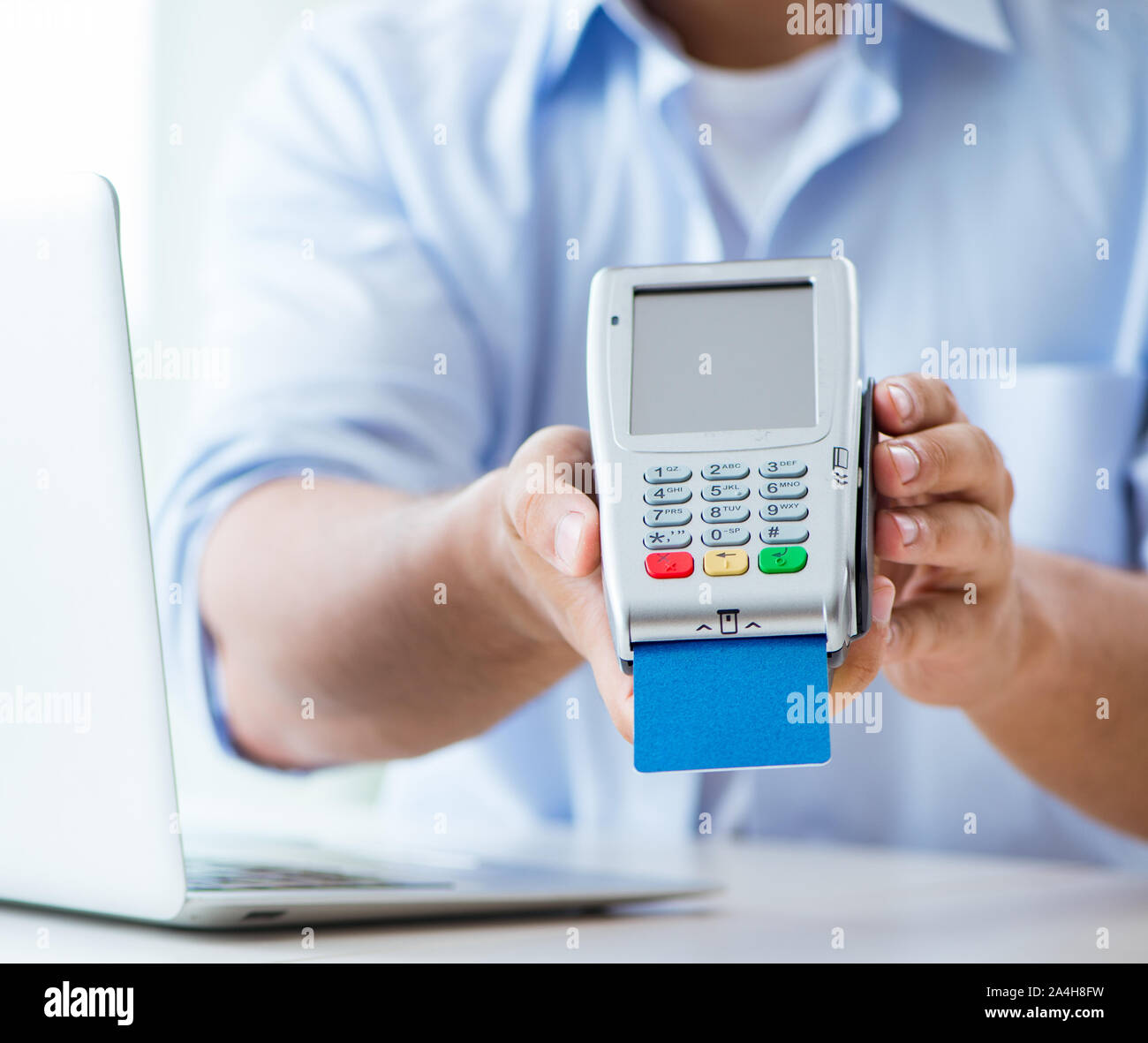 The man processing credit card transaction with pos terminal Stock ...