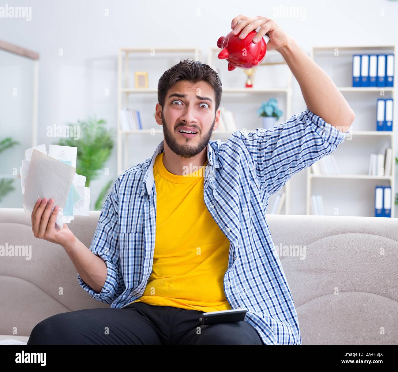 The man angry at bills he needs to pay Stock Photo - Alamy