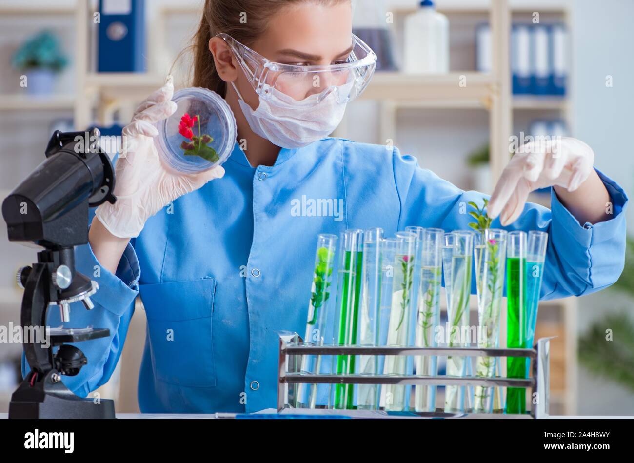 Female scientist researcher conducting an experiment in a laboratory ...