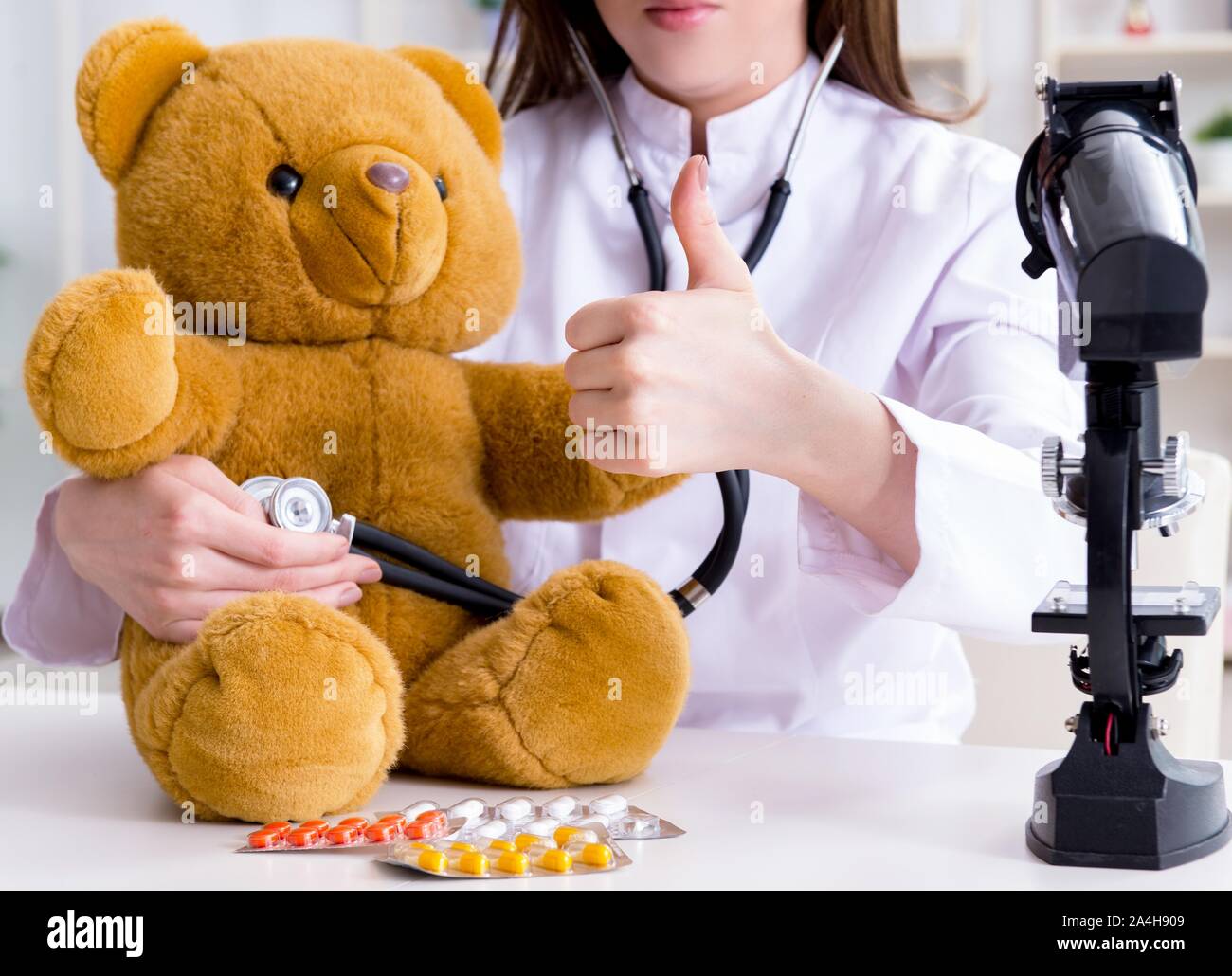 The child checking soft toy health Stock Photo - Alamy