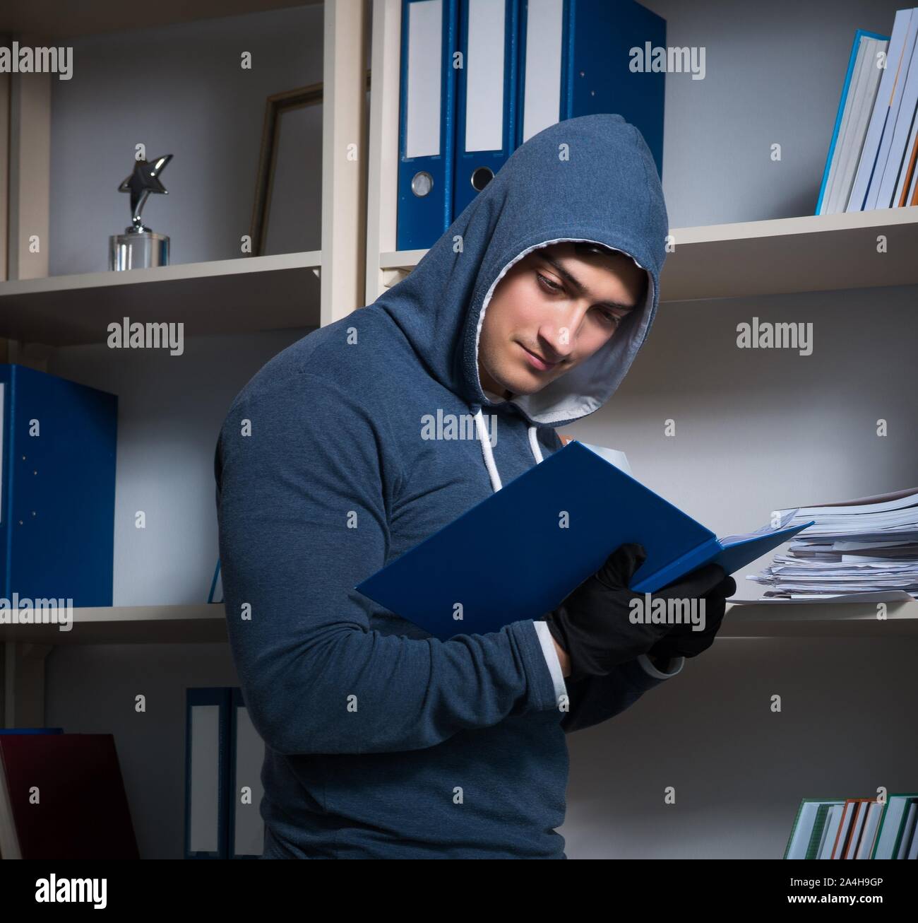 The young man in industrial espionage concept Stock Photo - Alamy