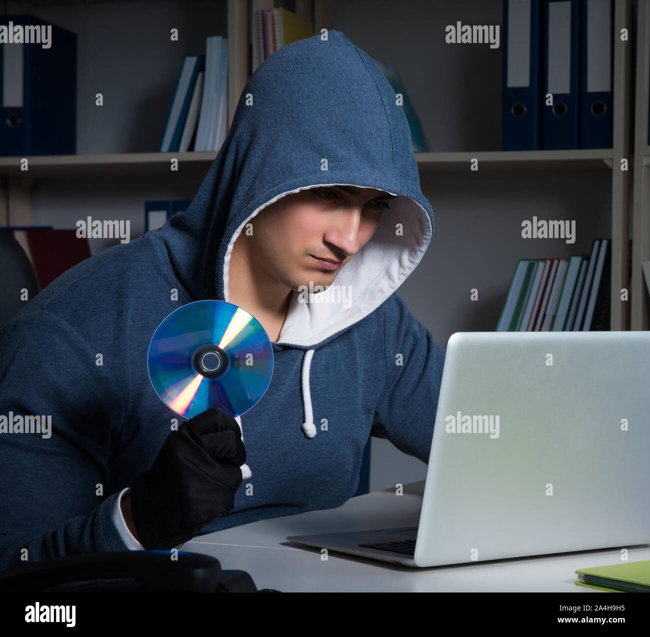 The young hacker hacking into computer at night Stock Photo - Alamy