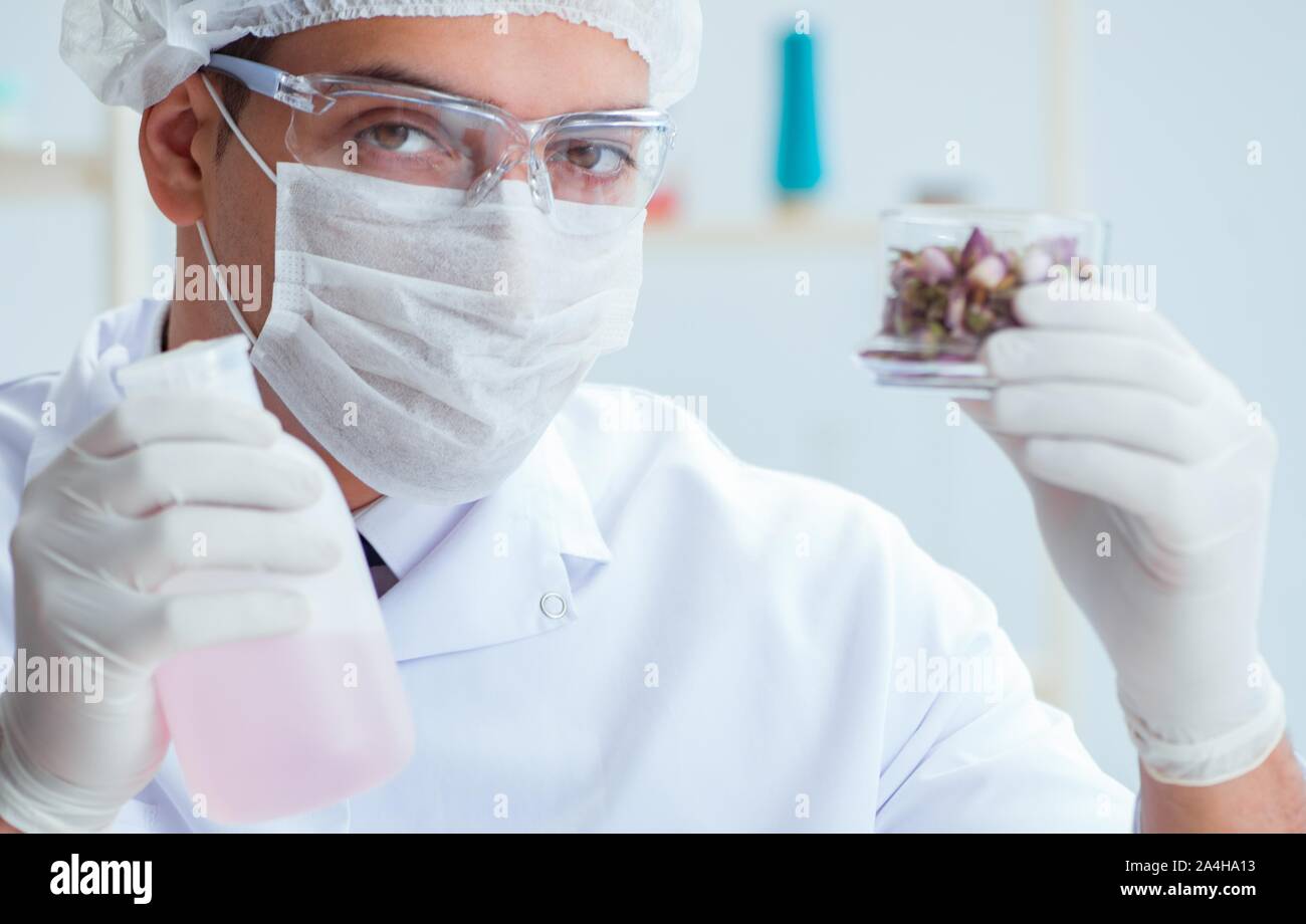 The chemist mixing perfumes in the lab Stock Photo - Alamy