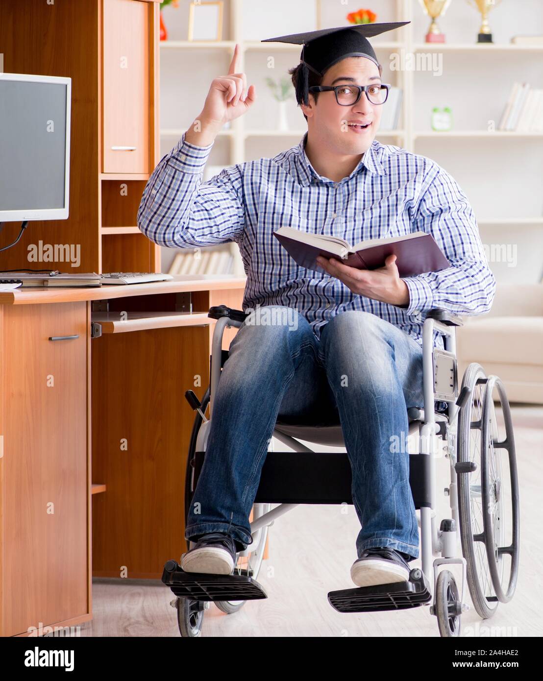 The disabled student studying at home on wheelchair Stock Photo - Alamy