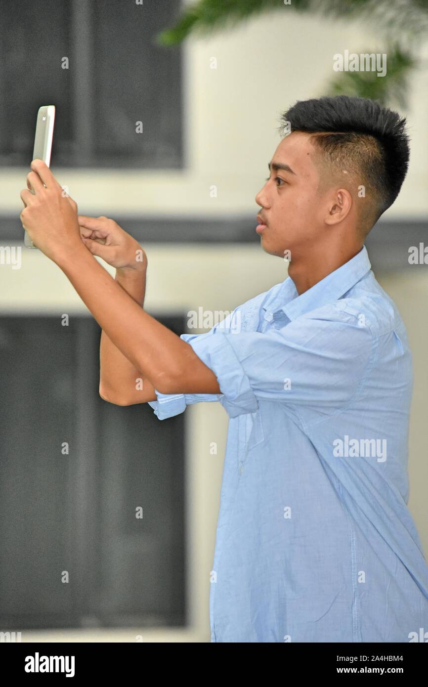 Teenage Male Using Tablet Stock Photo - Alamy