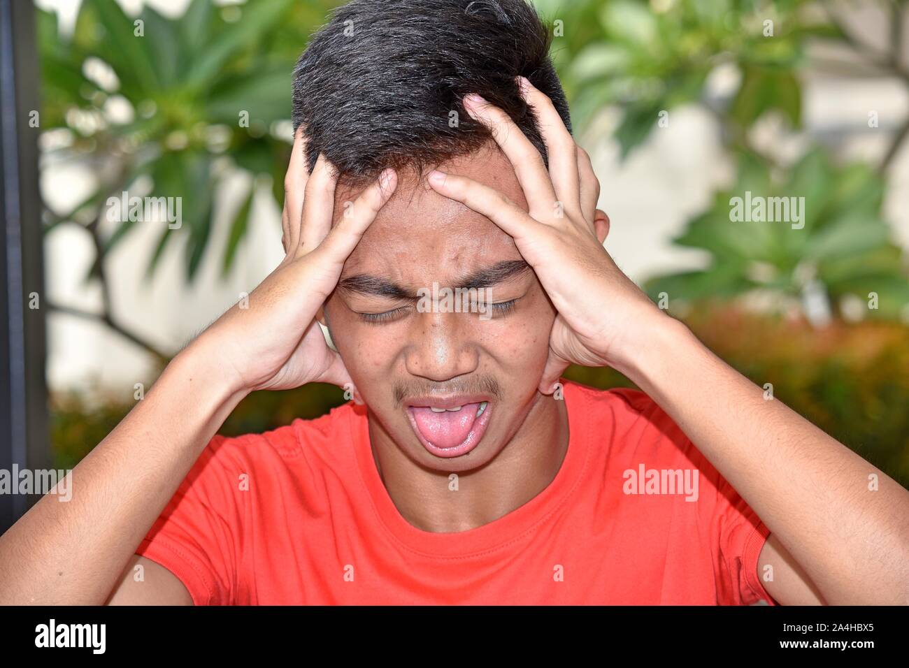 An Anxious Handsome Asian Person Stock Photo - Alamy