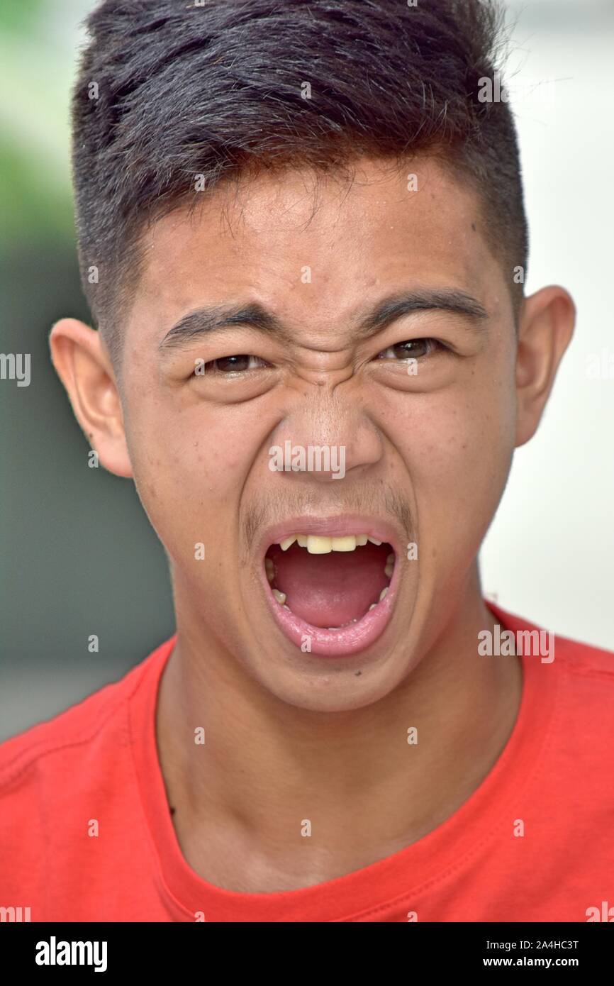 Youthful Minority Male Yelling Stock Photo - Alamy