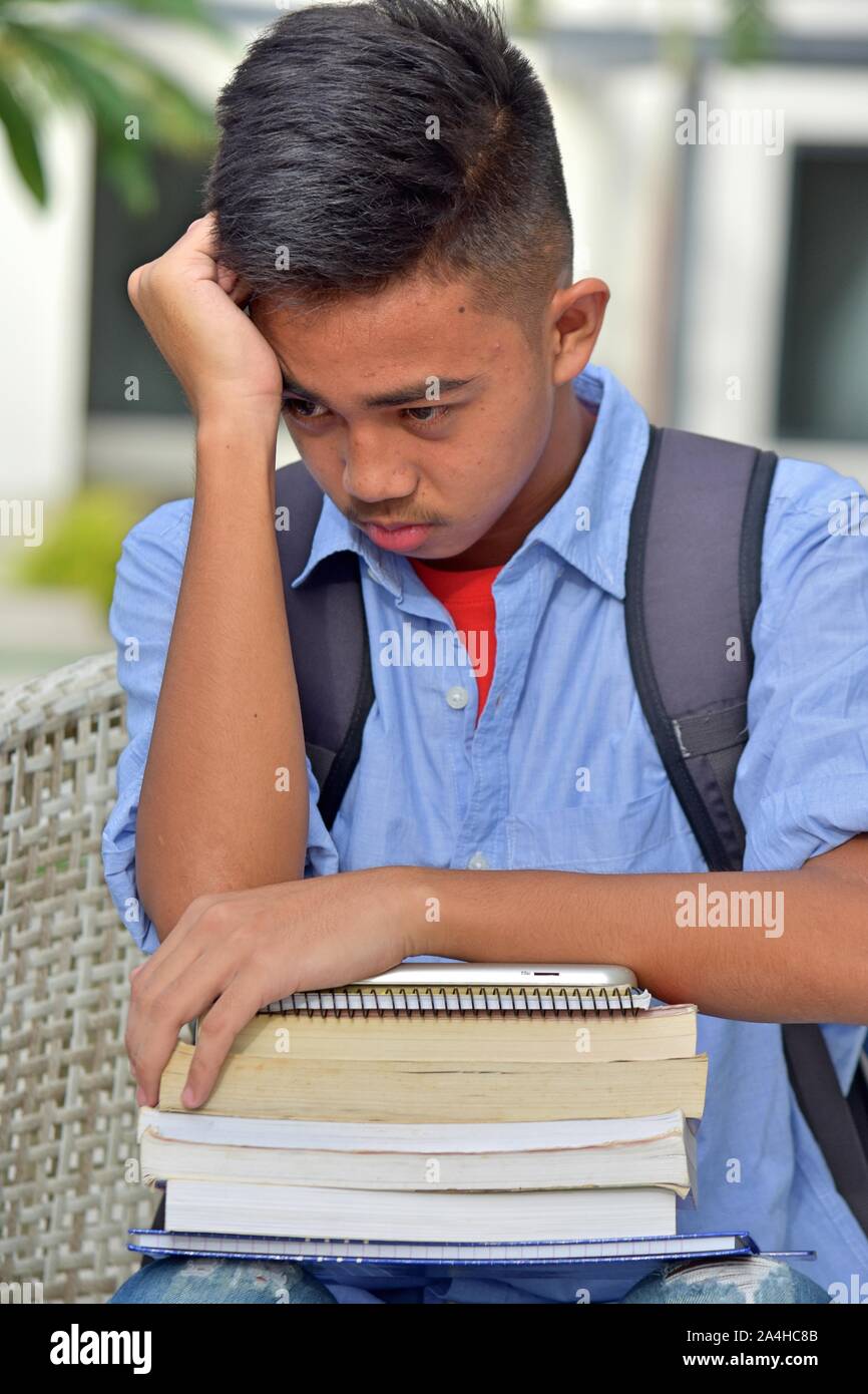 Boy Student And Sadness With Notebooks Stock Photo - Alamy