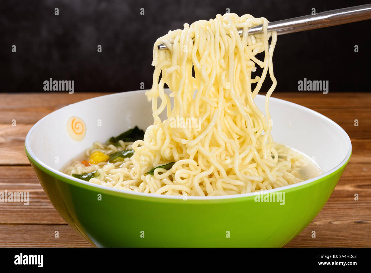 chopsticks picking up instant noodles with sauce Stock Photo - Alamy