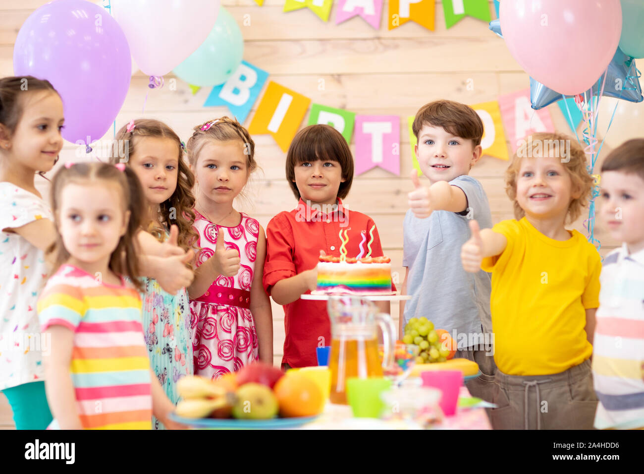 Group of preschool children celebrating birthday party together in ...