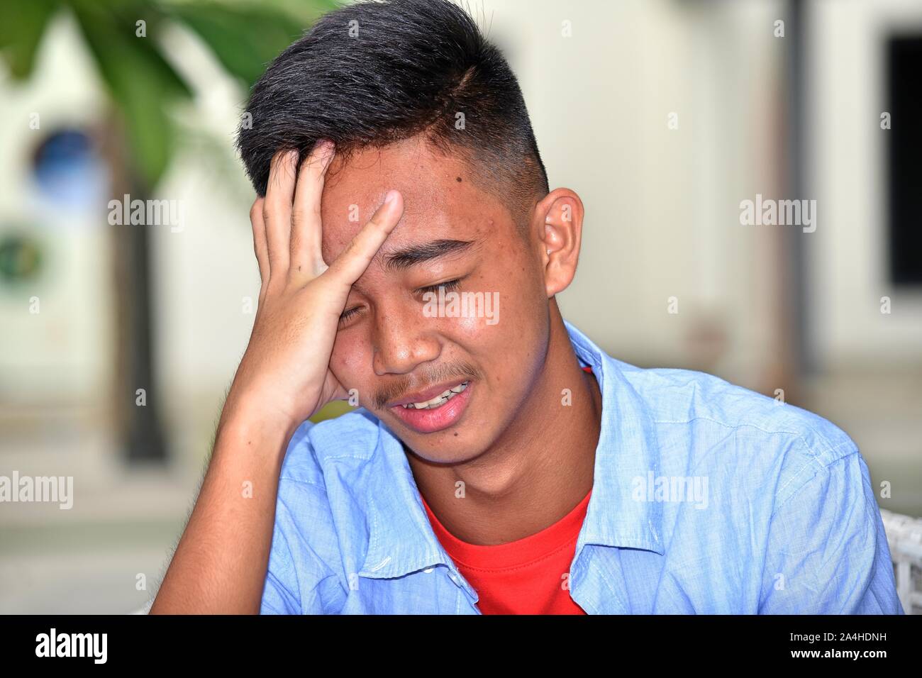 Stressful Filipino Boy Stock Photo - Alamy