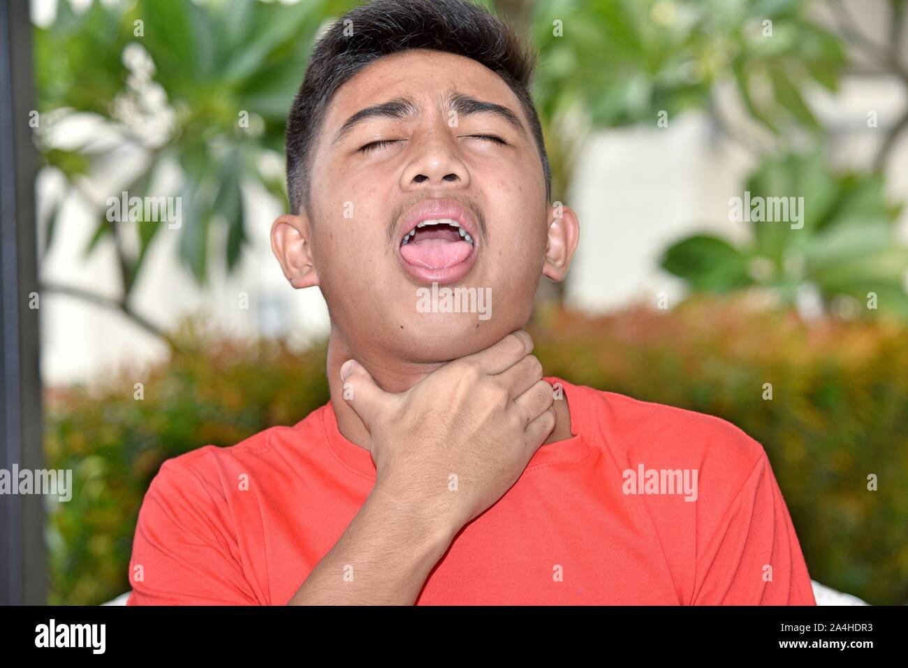 Male Youngster Choking Stock Photo - Alamy
