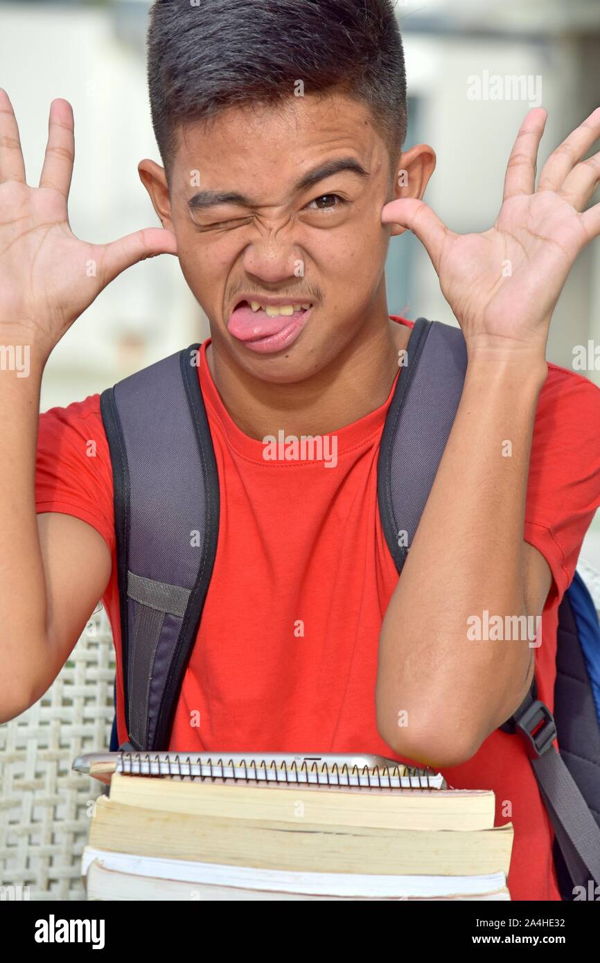 Silly Handsome Filipino Person With Notebooks Stock Photo - Alamy