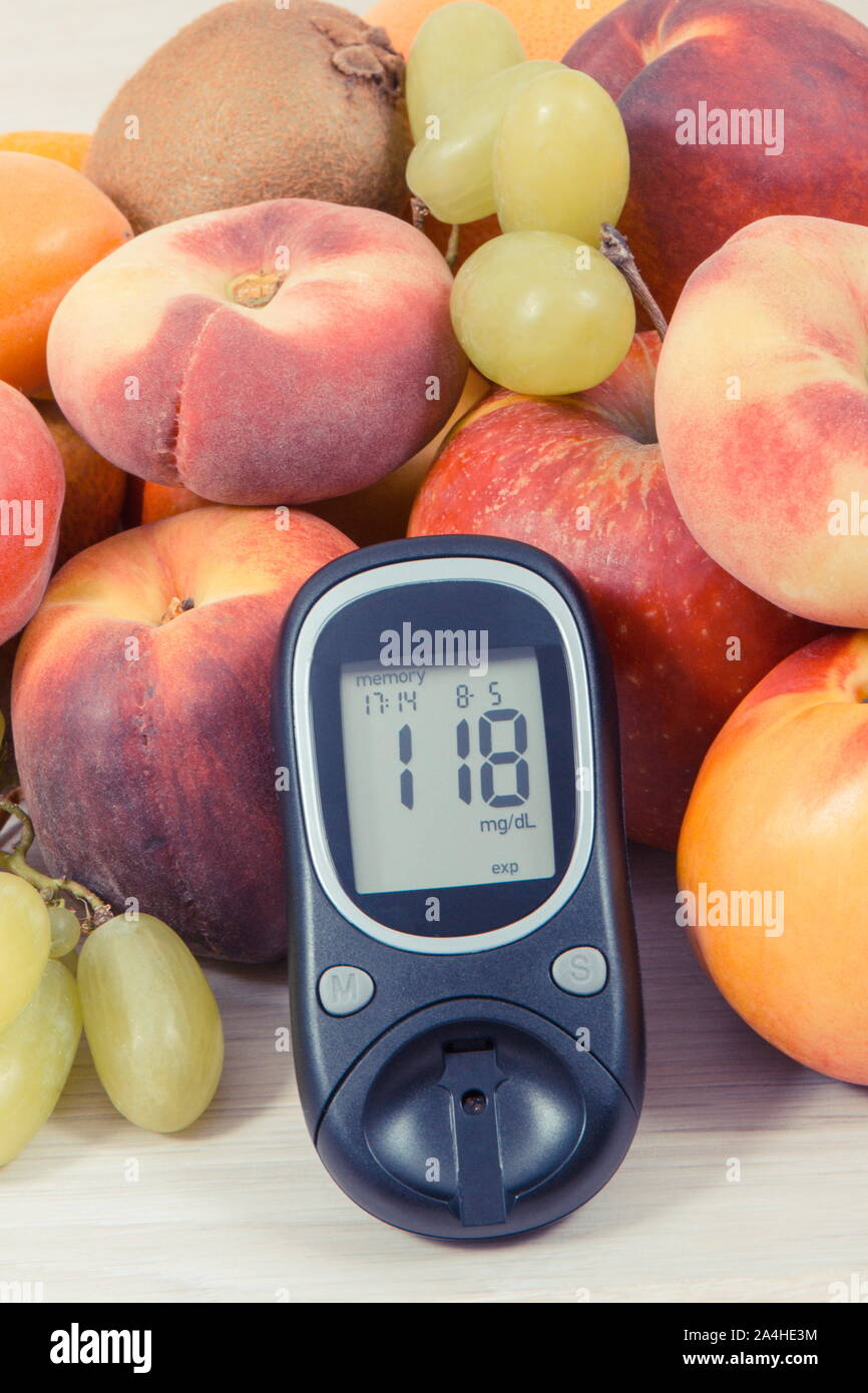 Glucometer for measuring sugar level and fresh nutritious food as ...