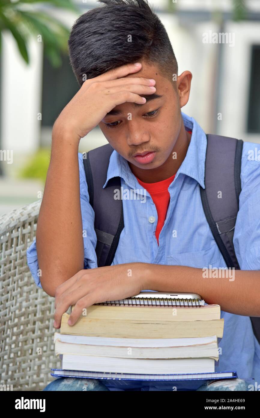Male Student Decision Making With Books Stock Photo - Alamy
