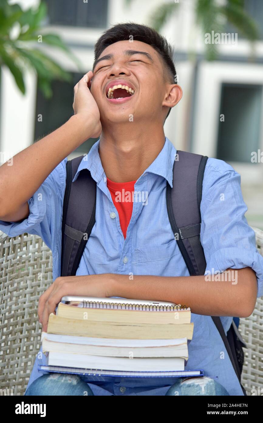 Boy Student And Laughter With Books Stock Photo - Alamy