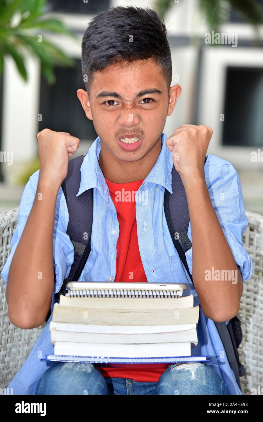 An Upset Young Boy Student Stock Photo - Alamy