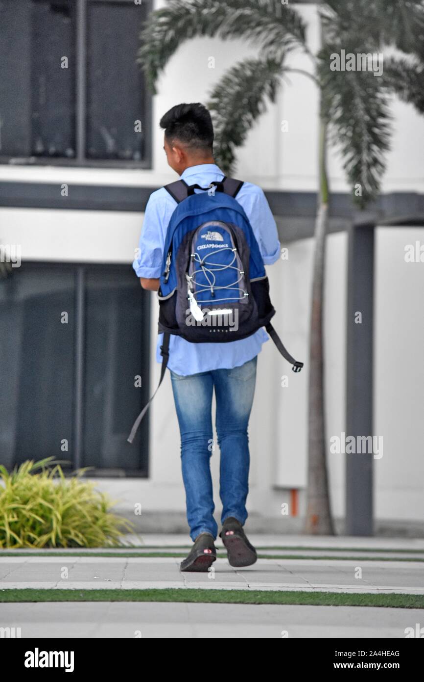 Student Walking Wearing Backpack Stock Photo - Alamy