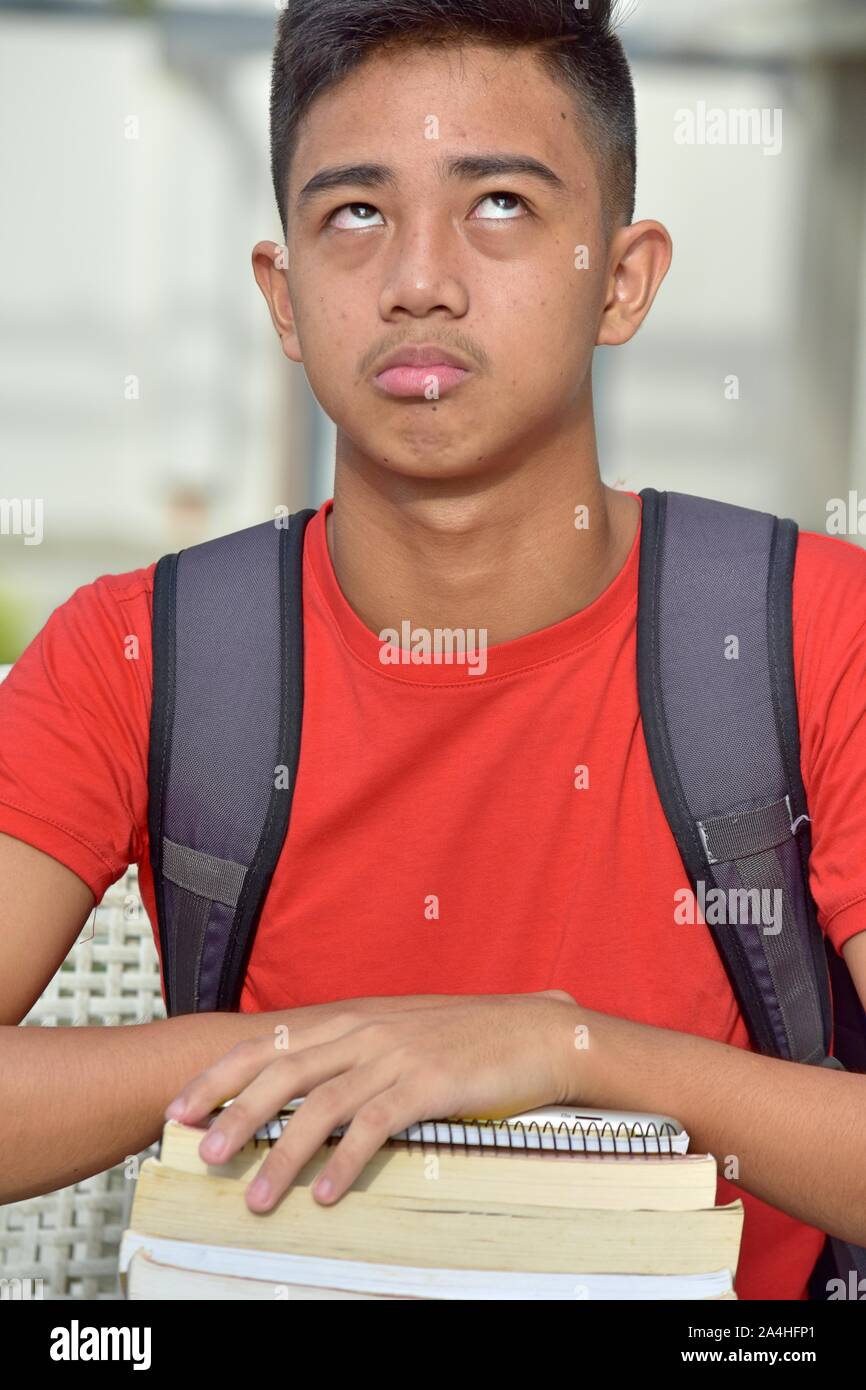 Contemplative asian boy hi-res stock photography and images - Alamy