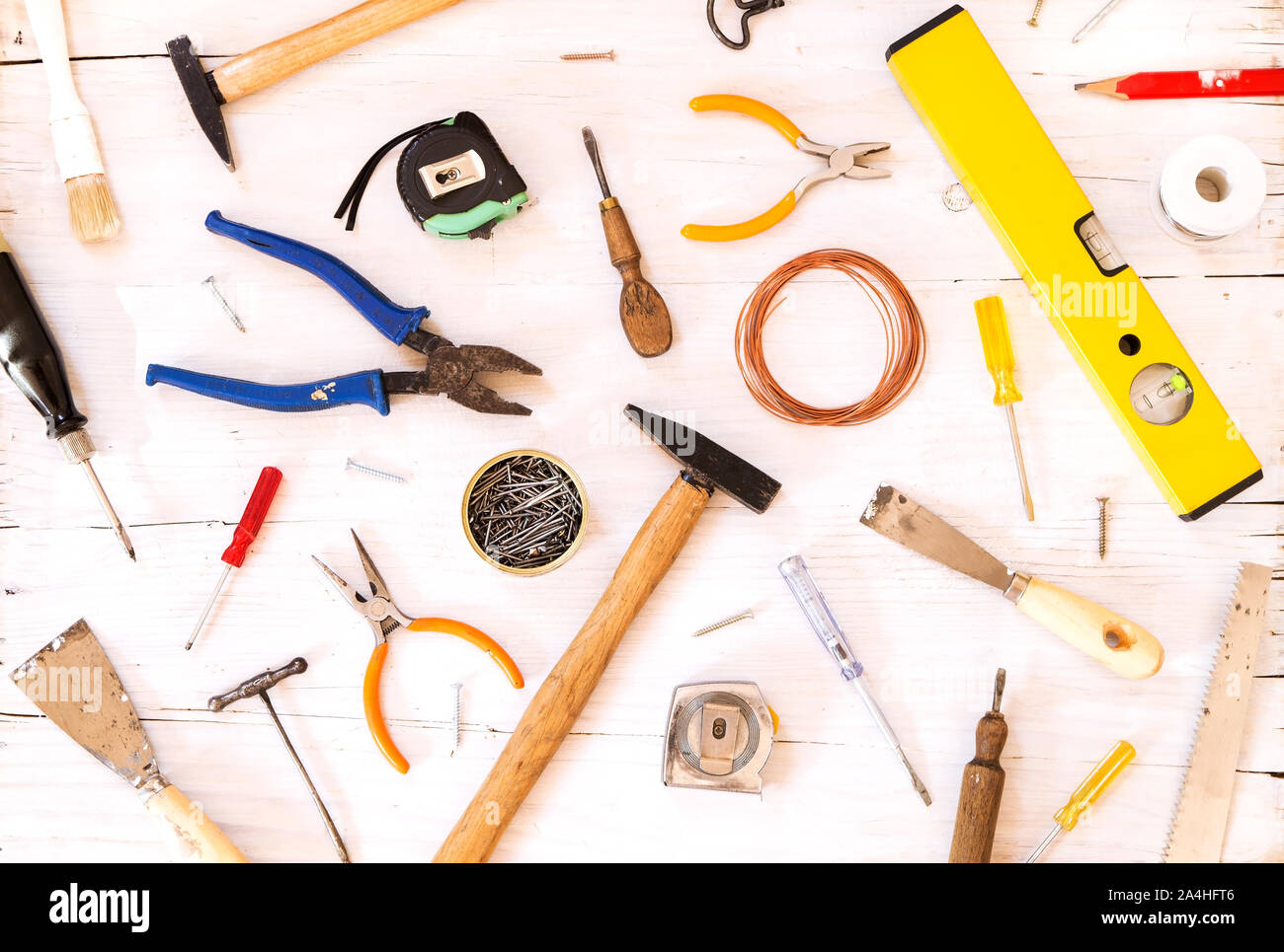 Tools collection on white wooden background Stock Photo - Alamy
