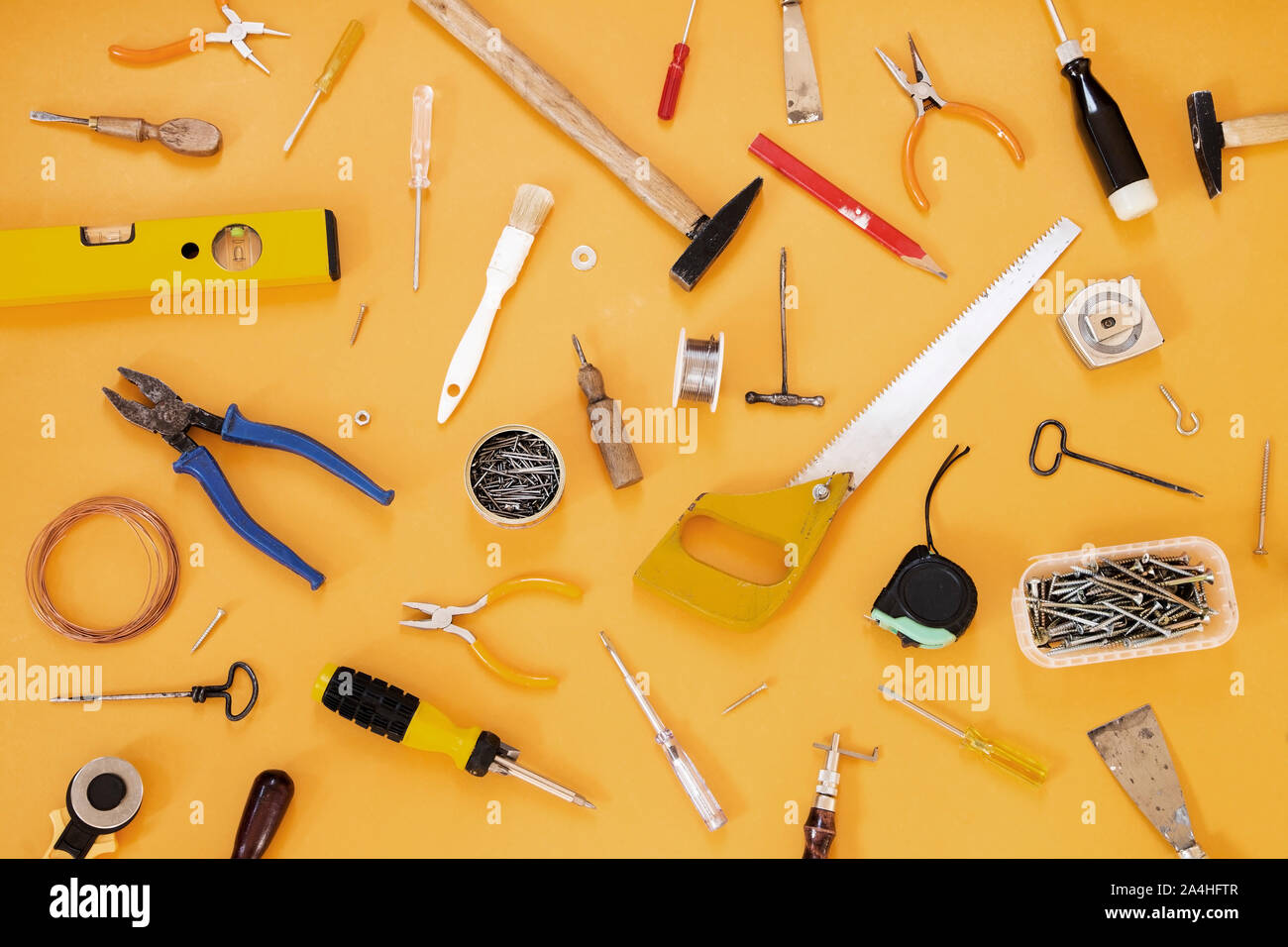 Tools collection on yellow background Stock Photo - Alamy