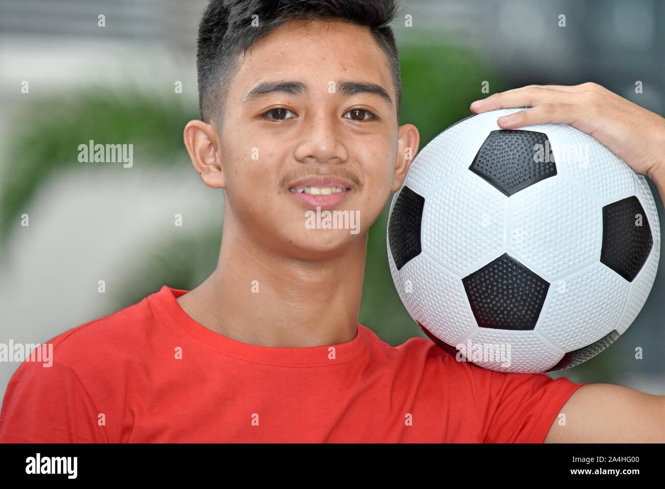 Athletic Asian Male Soccer Player Smiling Stock Photo - Alamy