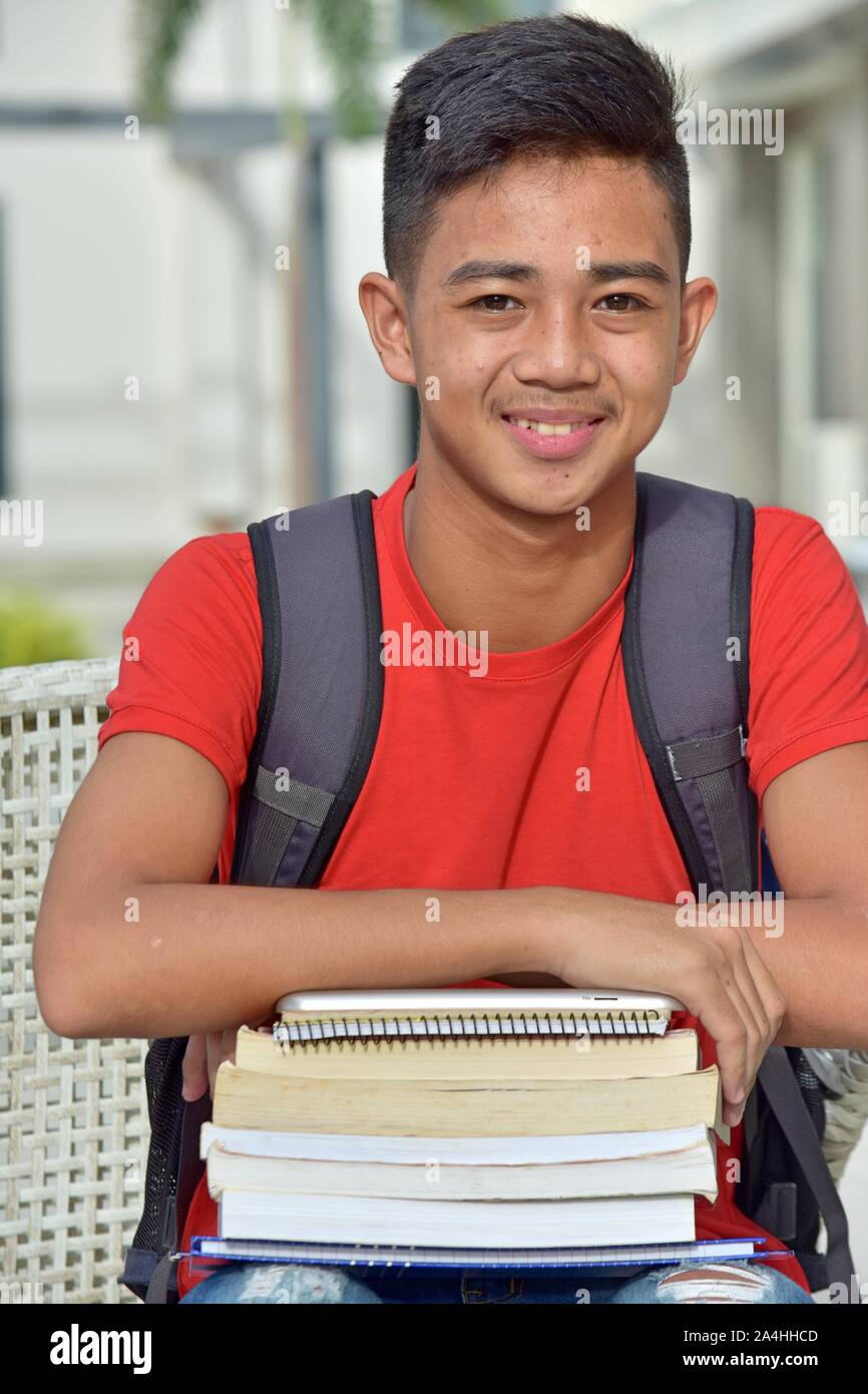 Smiling male student books hi-res stock photography and images - Alamy