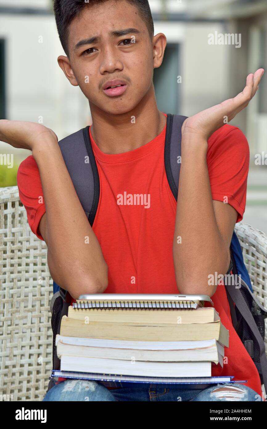 Male Student Making A Decision With Notebooks Stock Photo - Alamy