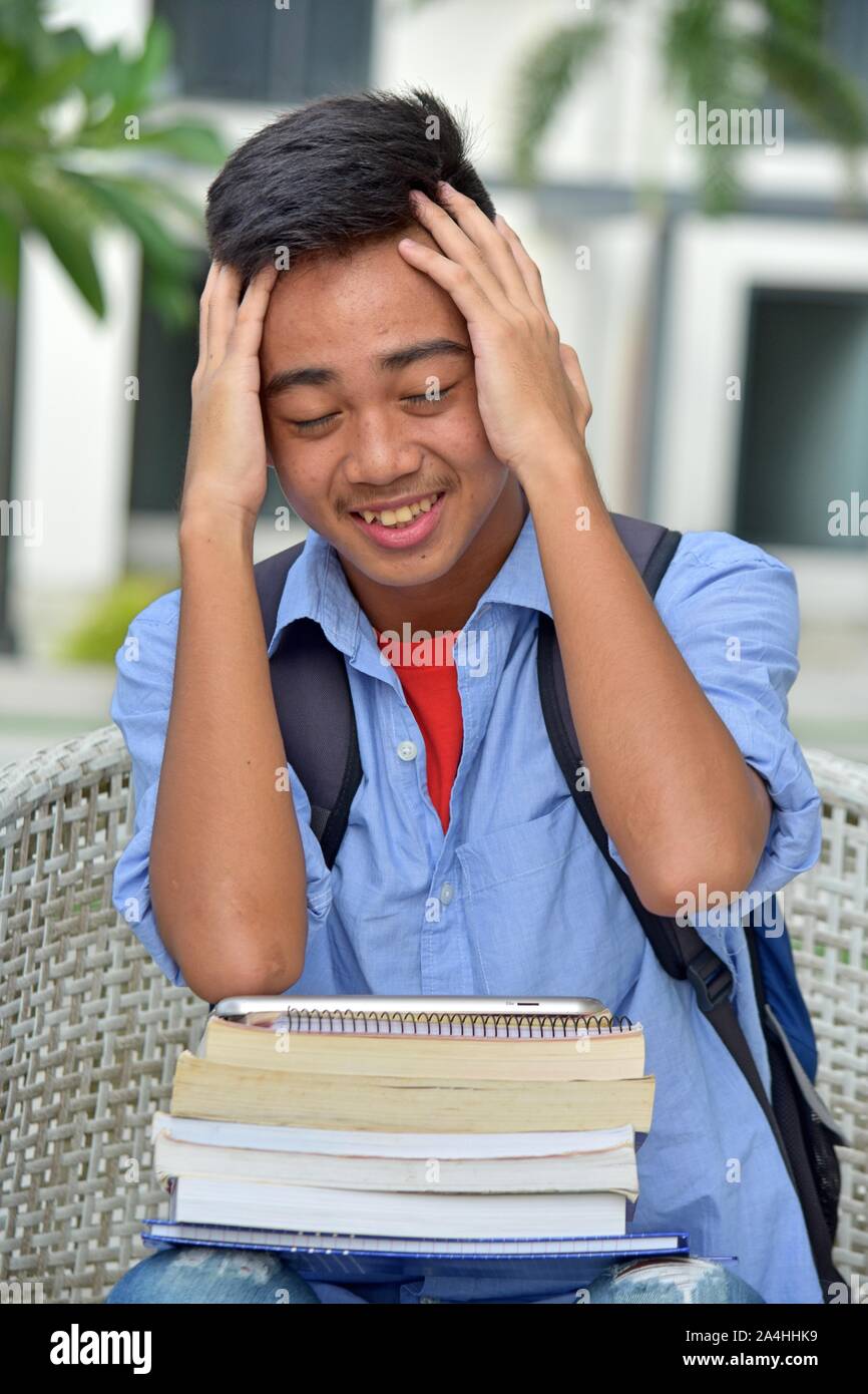University Filipino Male Student Portrait With Books Stock Photo - Alamy