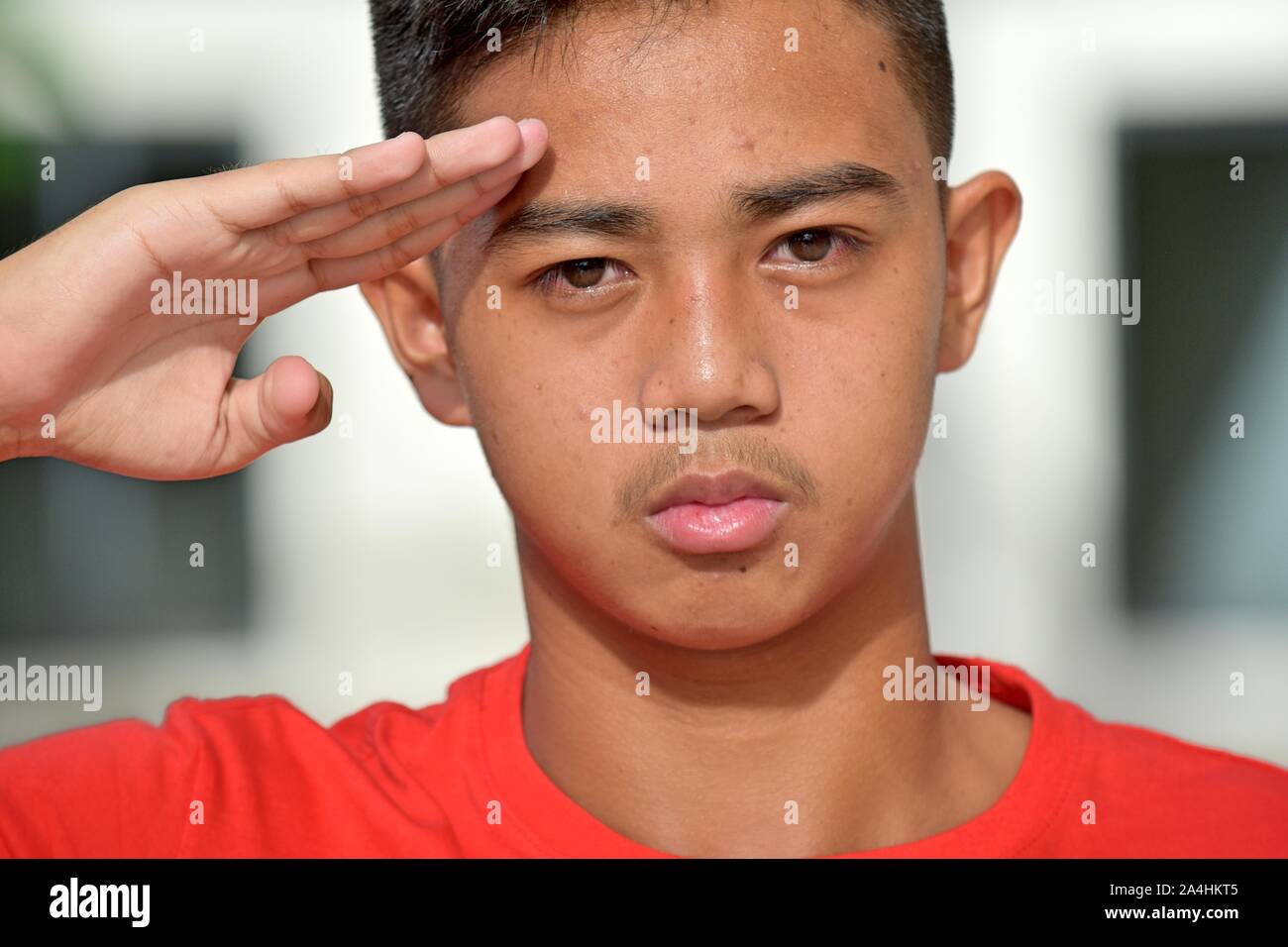 Diverse Boy Saluting Stock Photo - Alamy