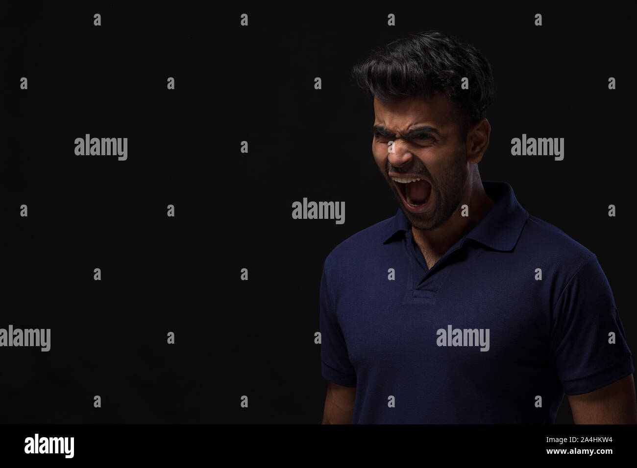 Portrait of a young man screaming Stock Photo - Alamy