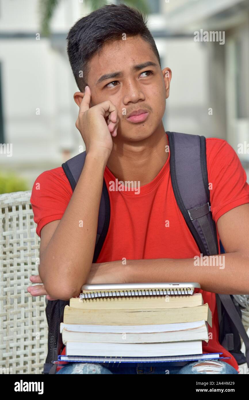Boy Student Making A Decision With Books Stock Photo - Alamy