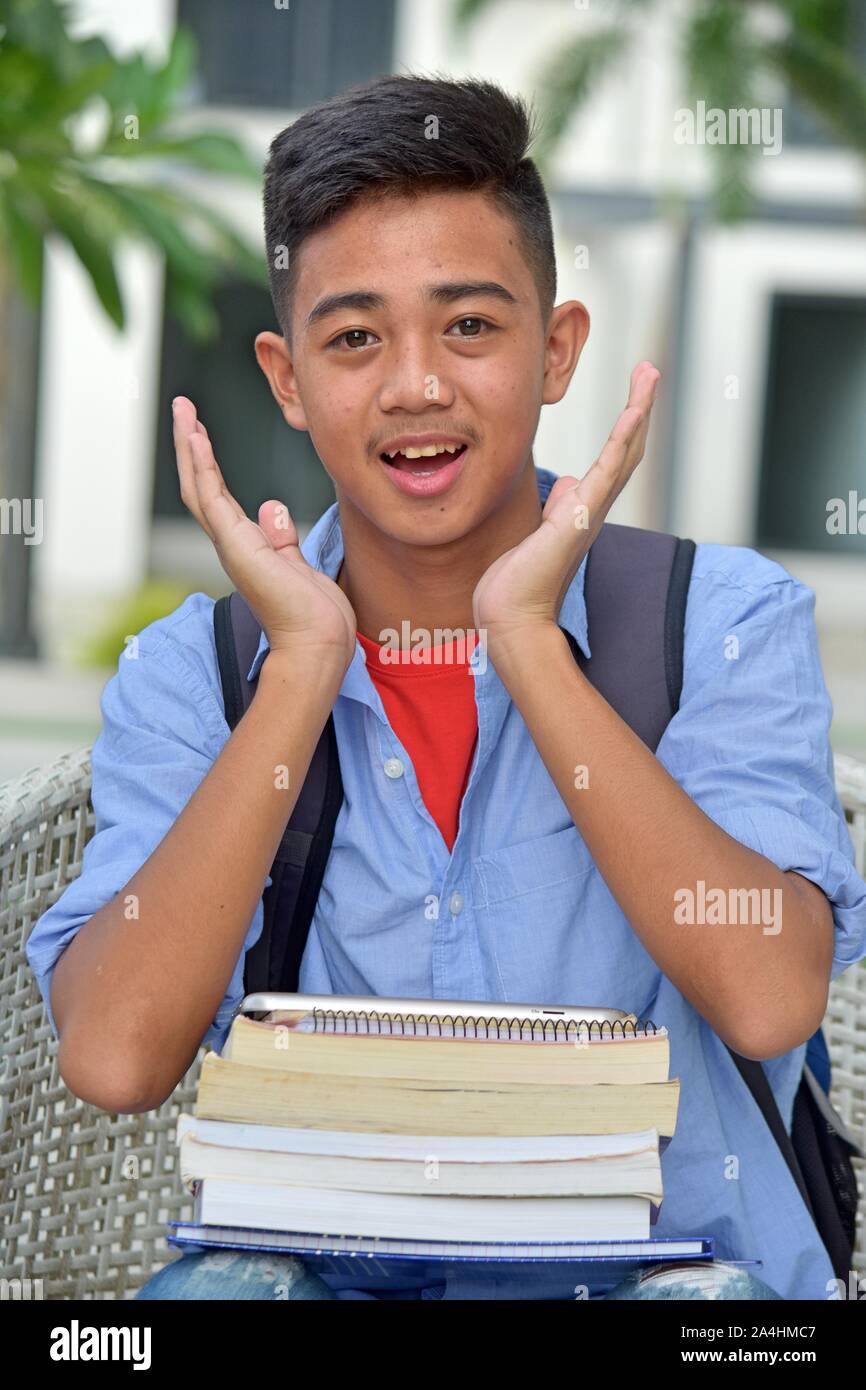 Surprised Handsome Asian Student With Notebooks Stock Photo - Alamy