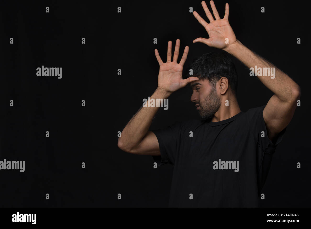 man with seasonal disorder blocking light with hands Stock Photo - Alamy