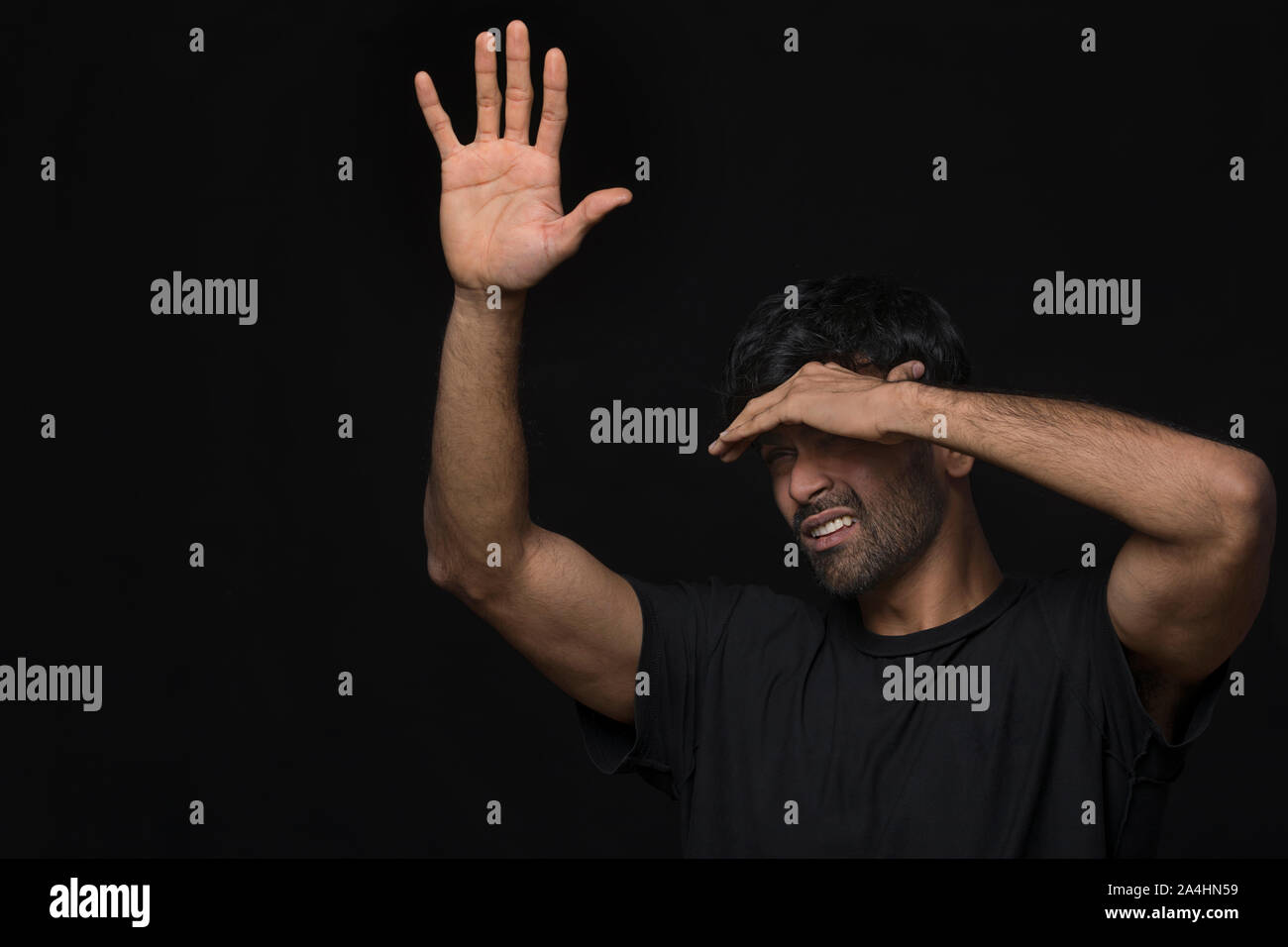 man with seasonal disorder blocking light with hands Stock Photo - Alamy