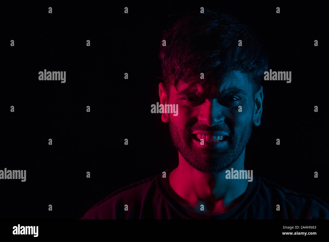 portrait of a crying man in red and blue Stock Photo - Alamy