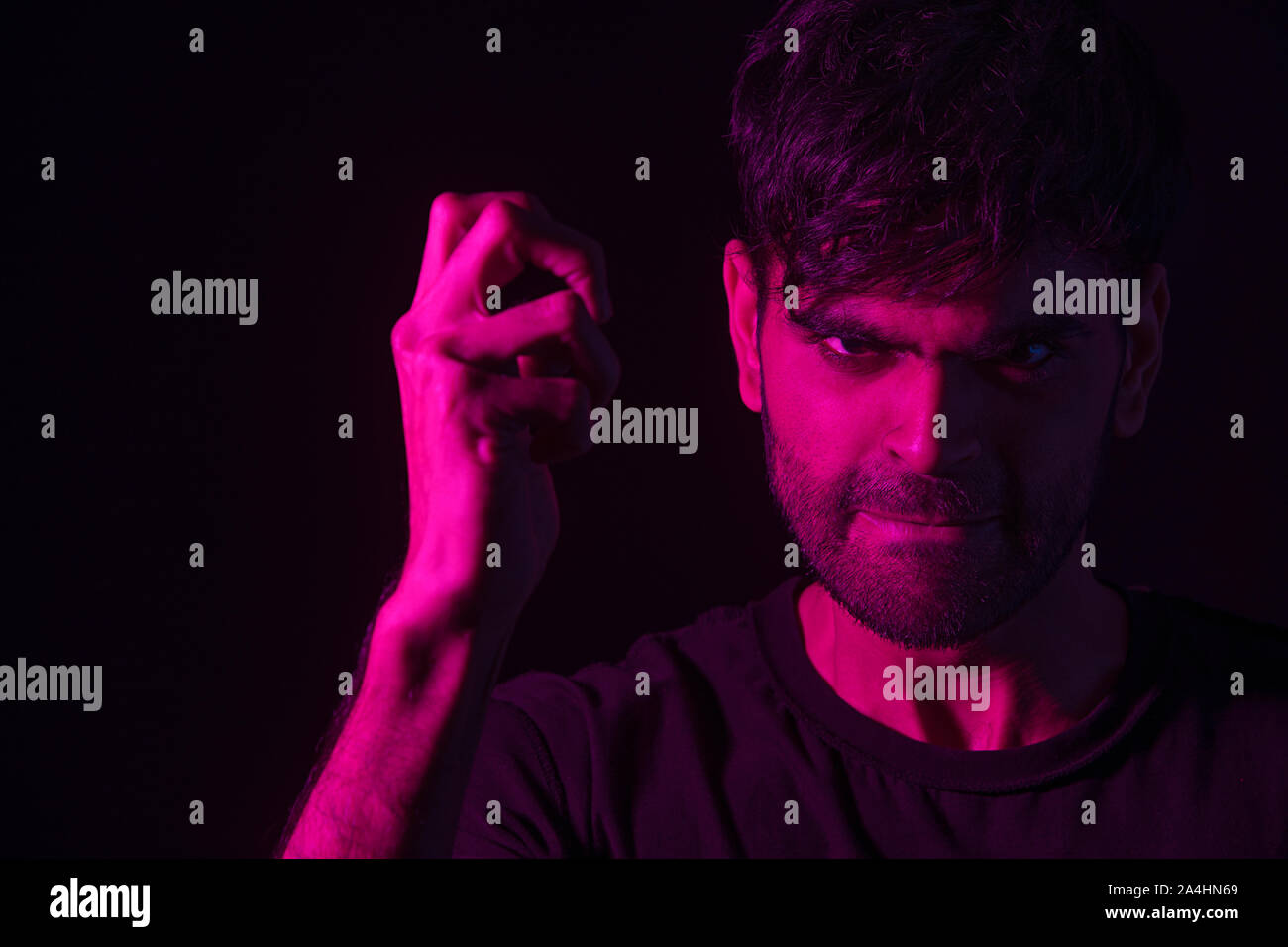 portrait of an angry man with clenched teeth in red Stock Photo - Alamy