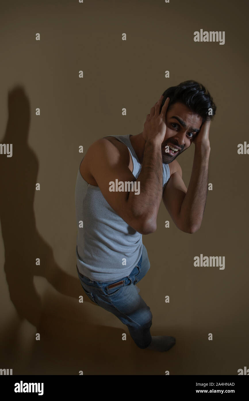 frightened young man Stock Photo - Alamy