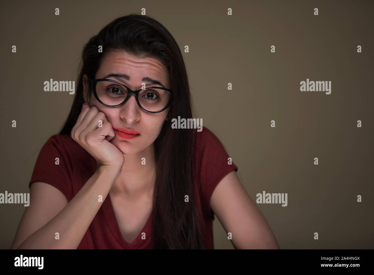 sad girl thinking at home Y Stock Photo - Alamy