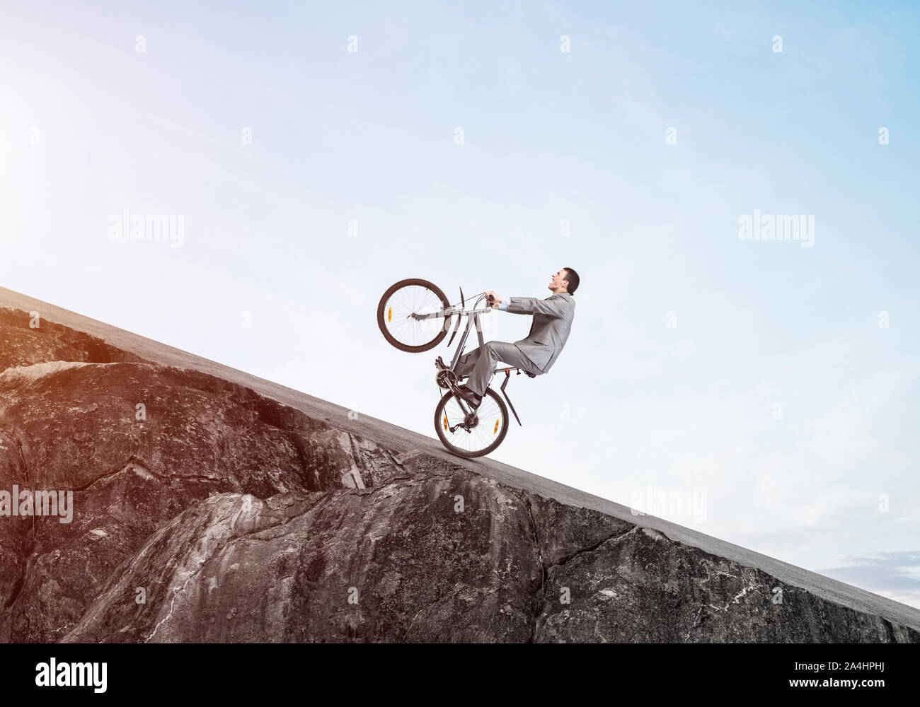 Person riding bike uphill hi-res stock photography and images - Alamy