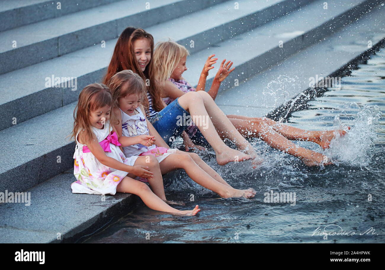 Girls splashing in the water Stock Photo - Alamy