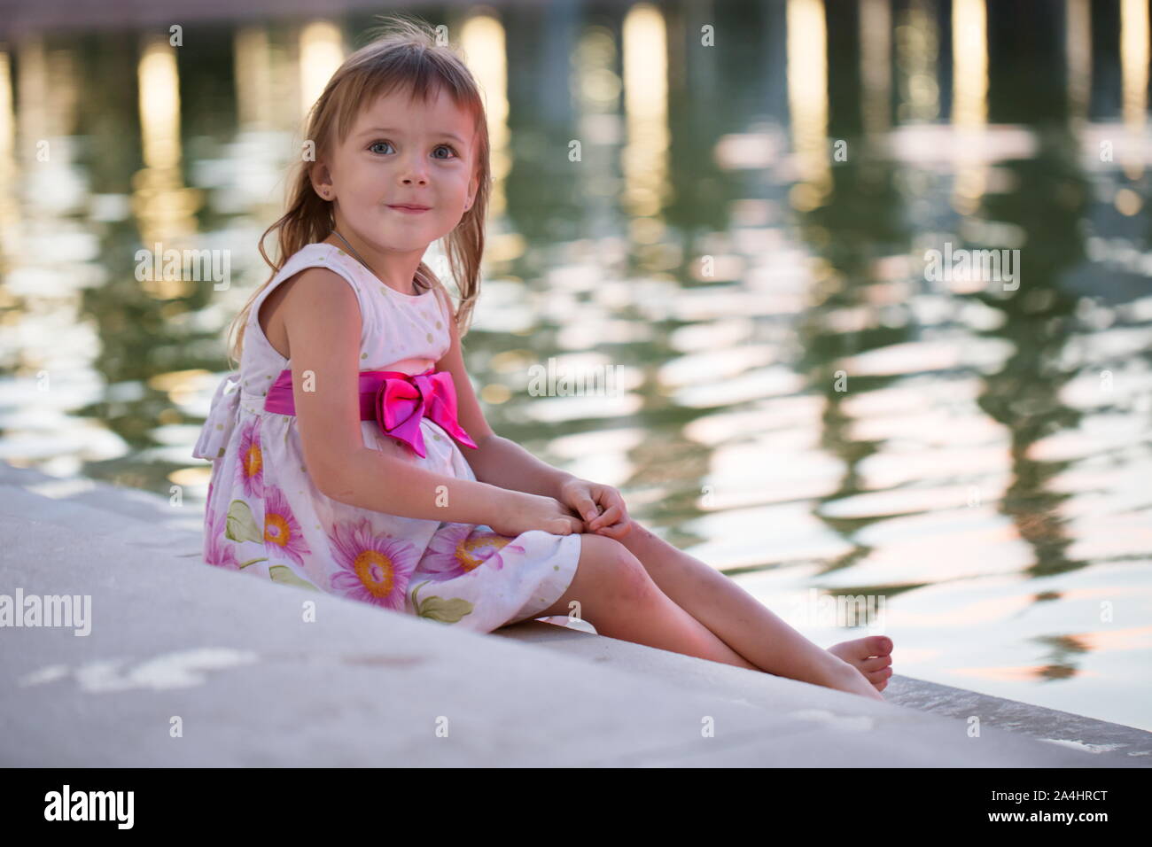 A girl stands in the fountain Stock Photo - Alamy